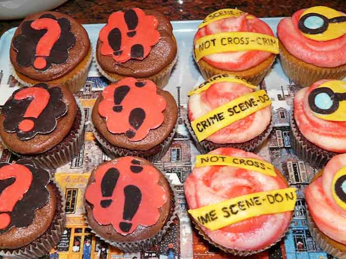 Crime scene cupcakes that are almost too adorable to eat, emphasis on almost because they're absolutely getting devoured.