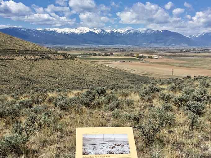 The Powder River Valley stretches endlessly below, the same view that made exhausted pioneers question their life choices.