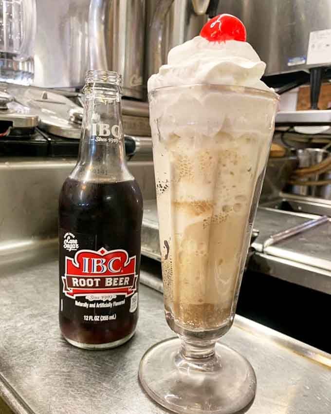 Root beer floats served in proper glassware with a cherry on top, because some traditions deserve respect.