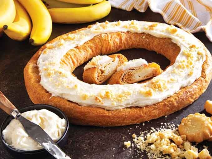 Behold the kringle in all its glory, topped with cream and ready to ruin your diet spectacularly.