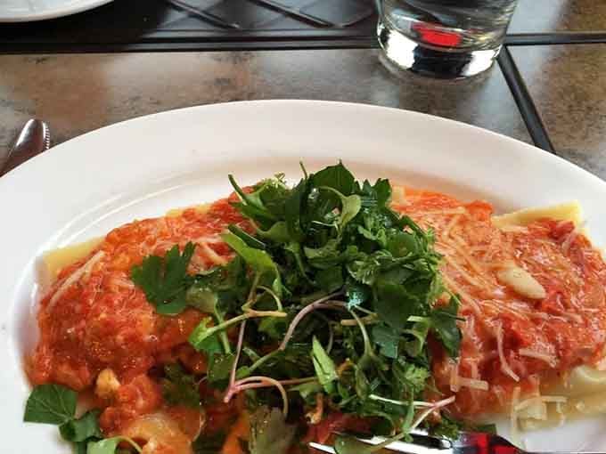 Lobster ravioli topped with fresh herbs proves that sometimes the fanciest dishes are also the most soul-satisfying.