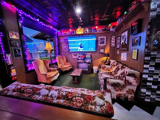 This retro lounge proves that sometimes the best gaming happens when you're sitting on a couch that's seen better decades.