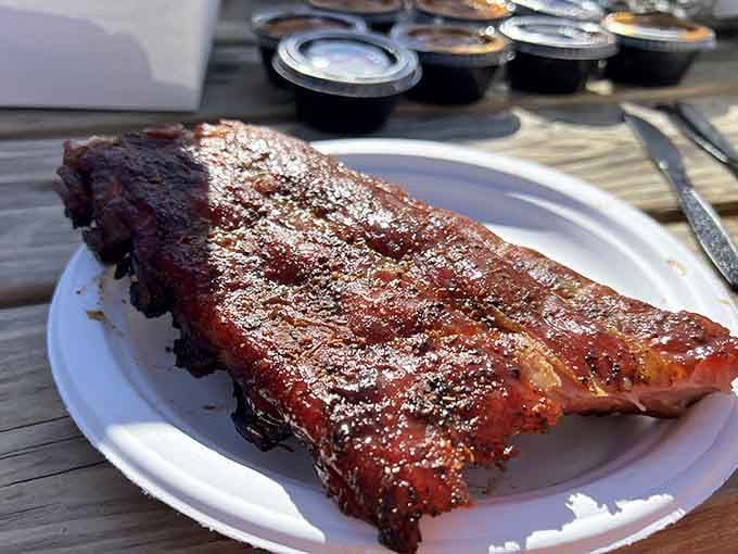 That mahogany bark and glistening surface prove patience and smoke create edible perfection every time.