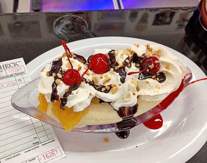 This banana split comes dressed to impress with whipped cream, cherries, and enough toppings to justify skipping dinner entirely.