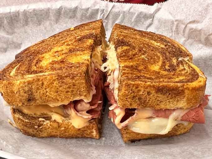 The Reuben on sourdough pumpernickel: proof that some sandwiches are worth the inevitable napkin shortage that follows.