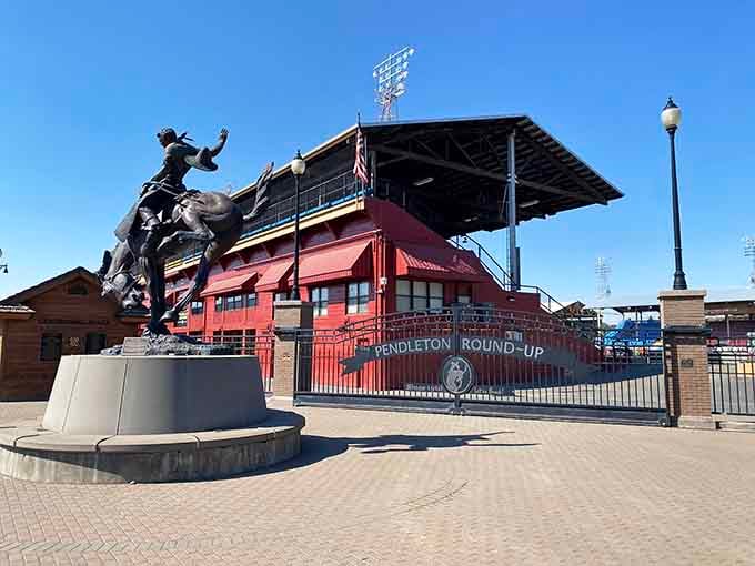The Round-Up grounds stand ready for September's rodeo magic, complete with a bronze bucking bronco statue.
