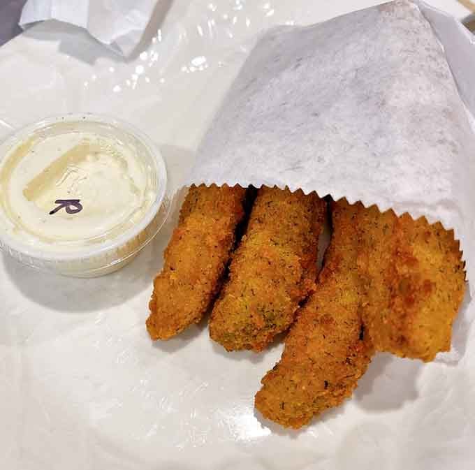 Golden, crispy fried pickles that prove sometimes the best ideas are the simplest ones executed perfectly.