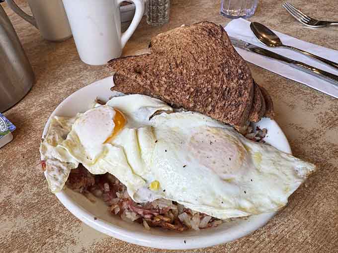Crispy hash browns, sunny-side eggs, and golden toast: breakfast that means serious, glorious business.