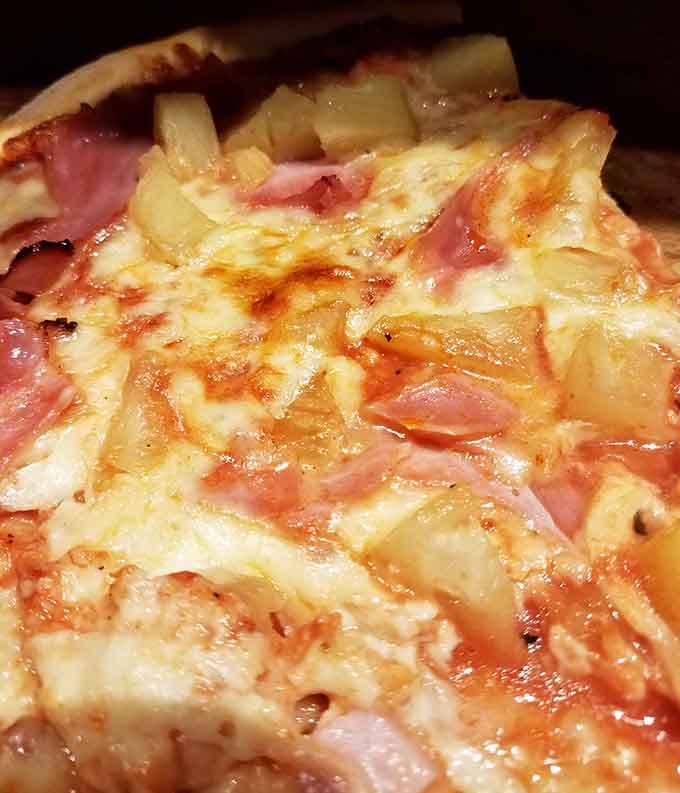 Hawaiian pizza done right, where sweet pineapple and savory ham create that controversial combination we secretly all love.
