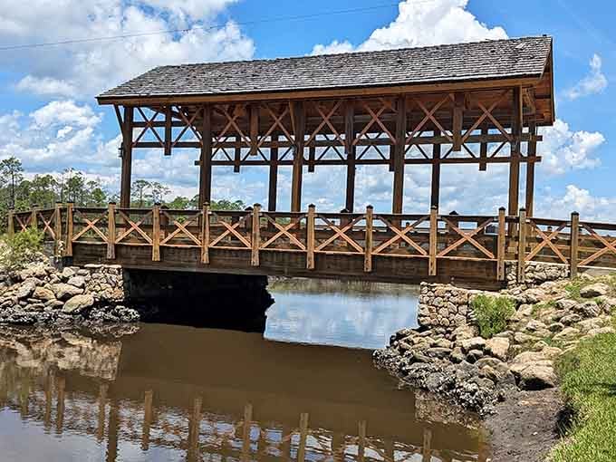 A covered bridge over tranquil waters where your biggest decision is whether to linger or keep exploring ahead.