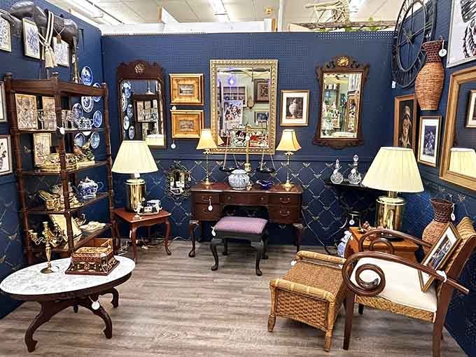 Navy walls showcase elegant furniture and crystal, like stepping into your sophisticated aunt's perfectly curated living room.