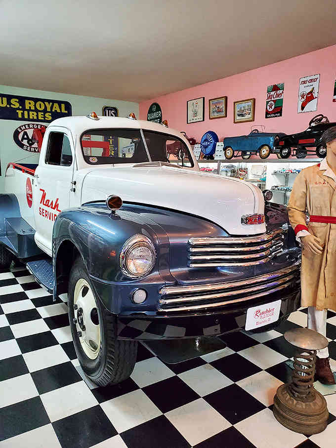 The Nash service truck proves workhorses can be beautiful too, especially against that pink wall and checkerboard floor.