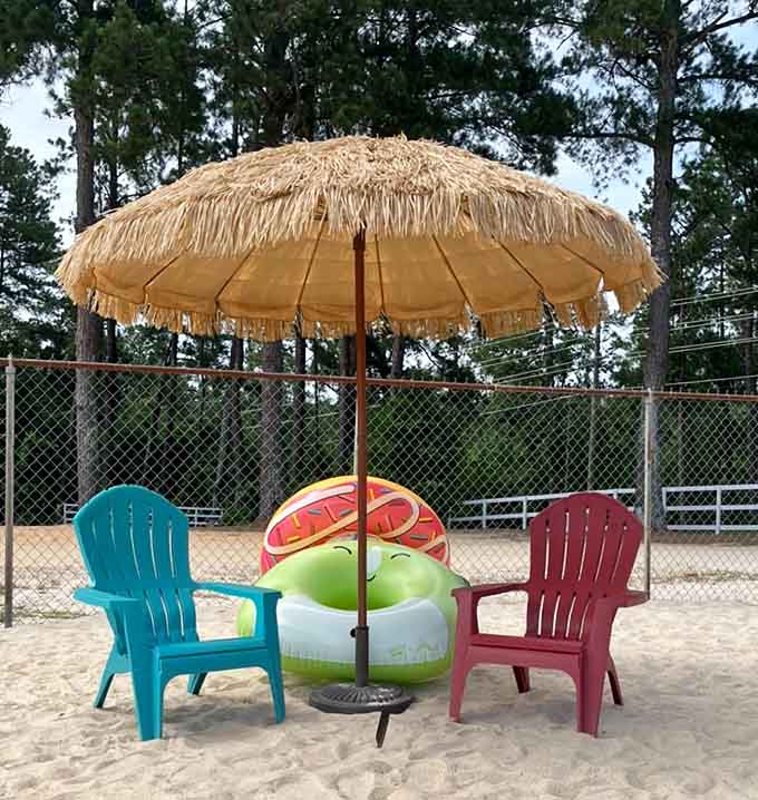 Someone understood the assignment: tiki umbrella, comfy chairs, and inflatable watermelon. Peak summer vibes achieved.