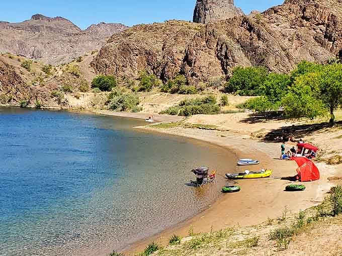 Sandy beaches and kayaks lined up like colorful jellybeans waiting for adventure on the water.