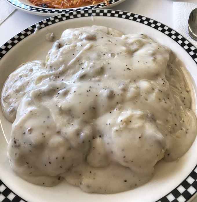 Biscuits and gravy so generous it looks like a fluffy cloud decided to take up residence on your plate &ndash; breakfast done right.