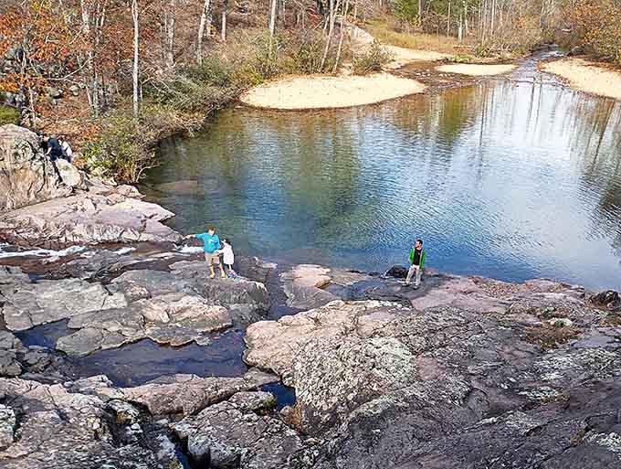 Low water reveals the geological playground where kids pretend they're explorers and adults remember what fun means.