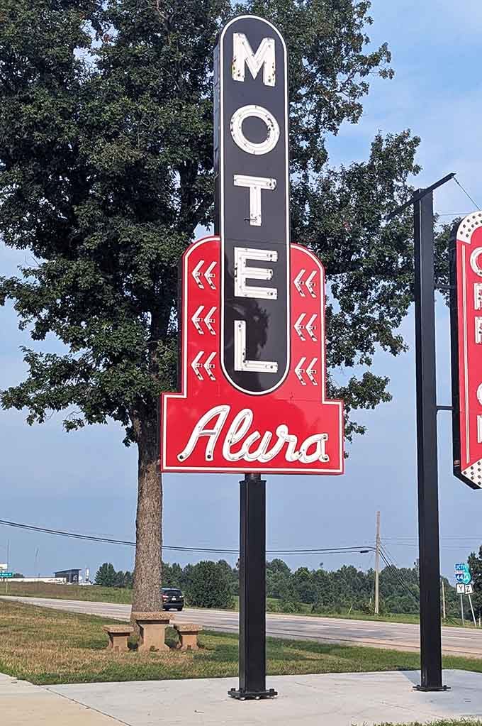 Motel Alura's towering sign stands proud, a vertical beacon that once guided countless families to a night's rest.