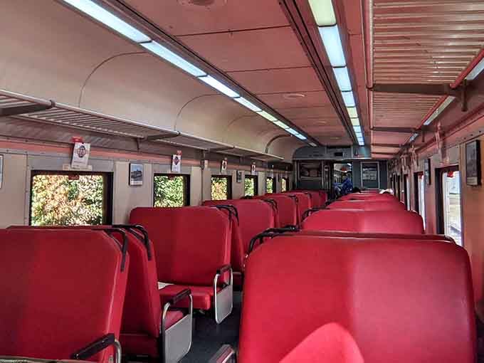 Those red seats have cradled countless passengers who discovered that comfortable train travel isn't just a memory from old movies.
