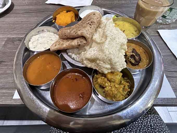 This is what happiness looks like on a plate: multiple curries, fresh breads, and enough variety to keep things interesting.