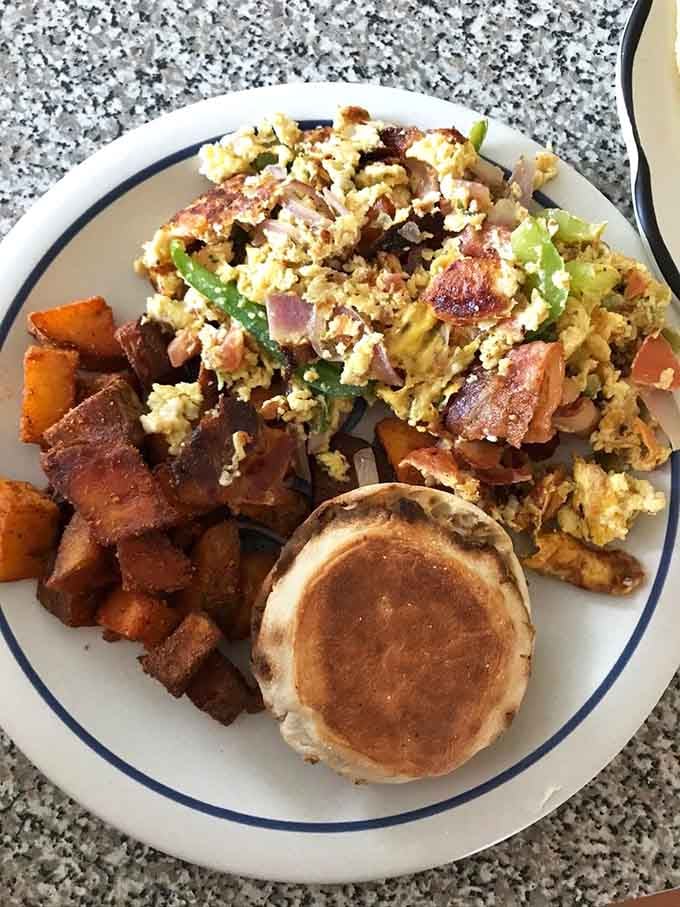 Golden pancakes, crispy home fries, and a scramble that looks like Sunday morning perfection on a plate.