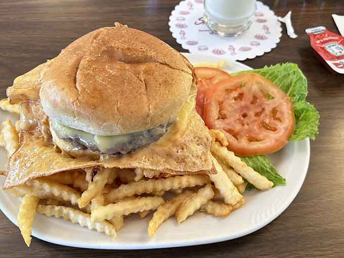 Behold the crispy cheese crown that launched a thousand road trips and converted countless burger skeptics forever.