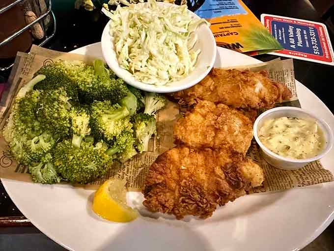 Golden fried chicken with broccoli and coleslaw proves you can have your vegetables and eat fried food too.