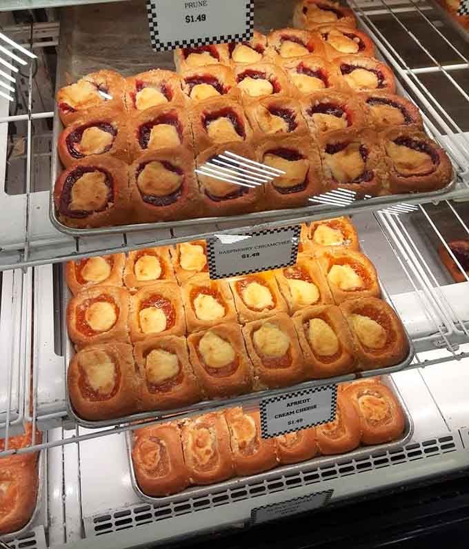 Fresh kolaches lined up like edible soldiers, each one filled with fruit that actually tastes like fruit. Revolutionary concept.
