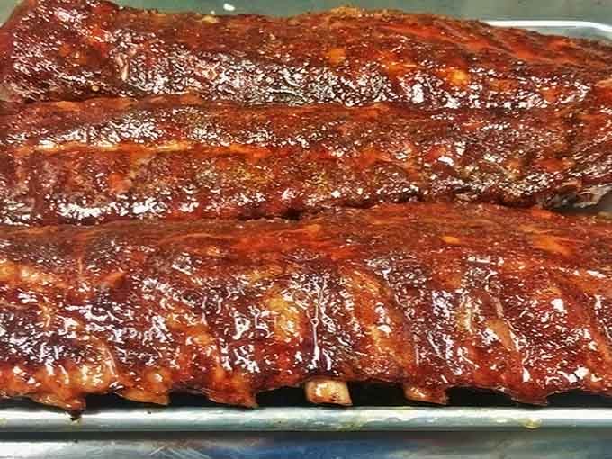 These ribs have that glossy, caramelized finish that makes grown adults forget their table manners entirely.