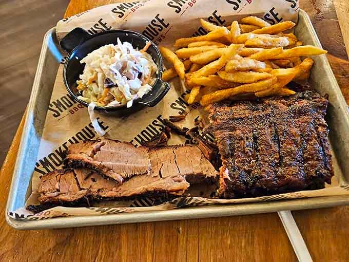 Brisket, ribs, fries, and coleslaw on a tray: the four food groups of barbecue happiness.