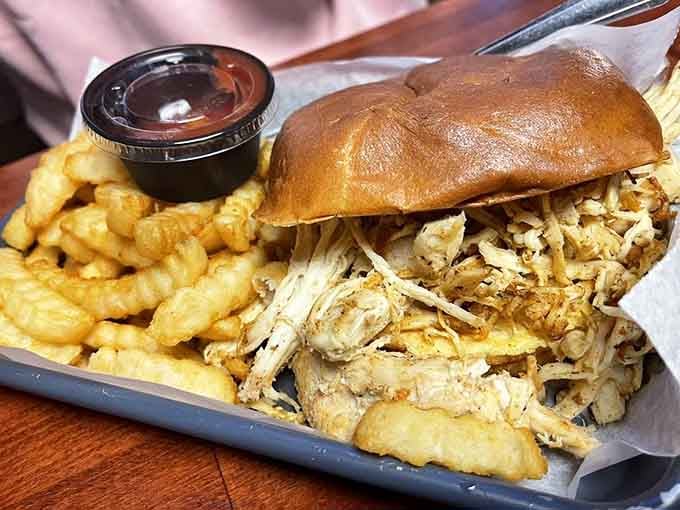 Behold: a pulled pork sandwich that laughs in the face of portion control and wins every single time.