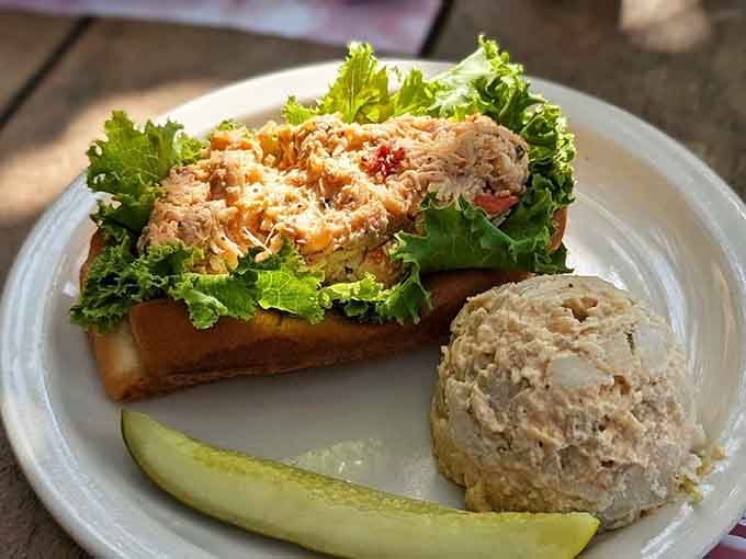 That lobster roll is stuffed so generously, the bun is practically waving a white flag in delicious surrender right now.