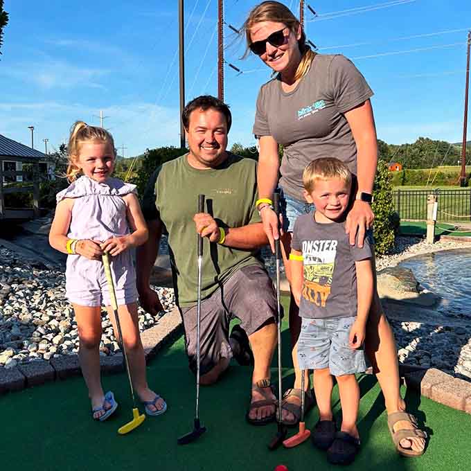 Mini golf brings families together because nothing says bonding like watching Dad miss an easy putt for the third time.