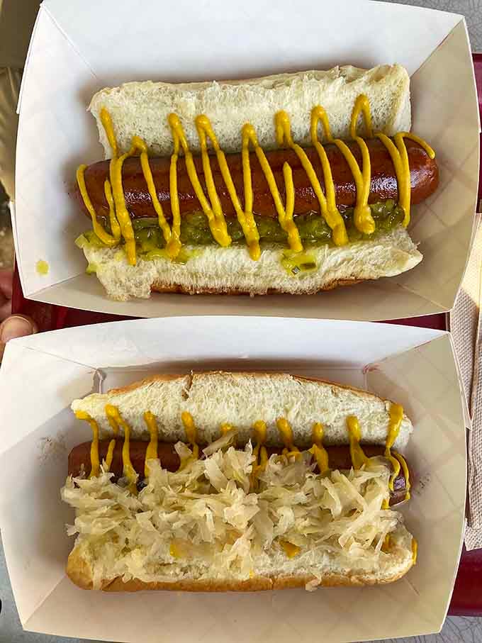 Sauerkraut and onions piled high on a perfectly grilled dog prove simplicity still reigns supreme in American cuisine.