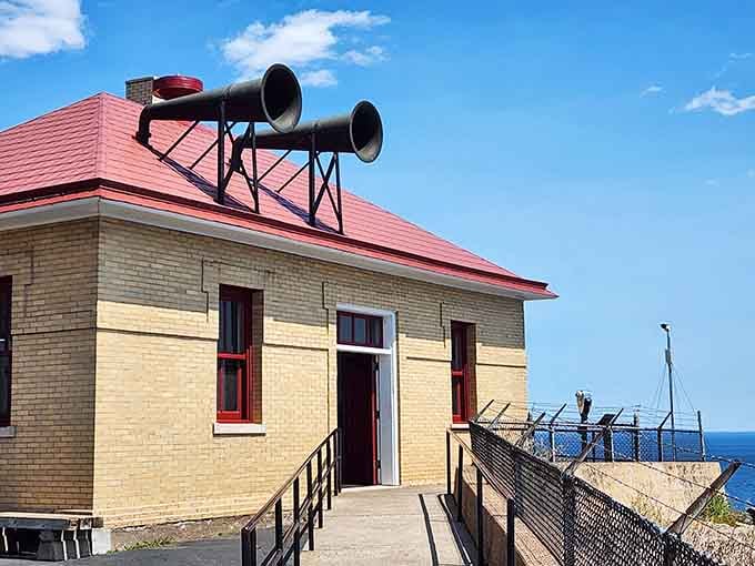 Those fog horns on the roof once bellowed warnings across the water, saving countless ships from disaster below.