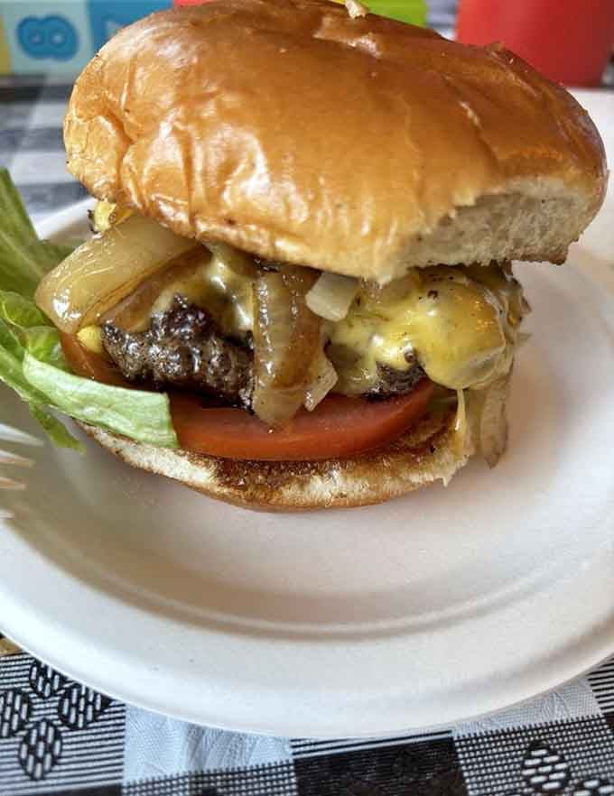Caramelized onions cascading over melted cheese on a toasted bun is basically the American dream in edible form.