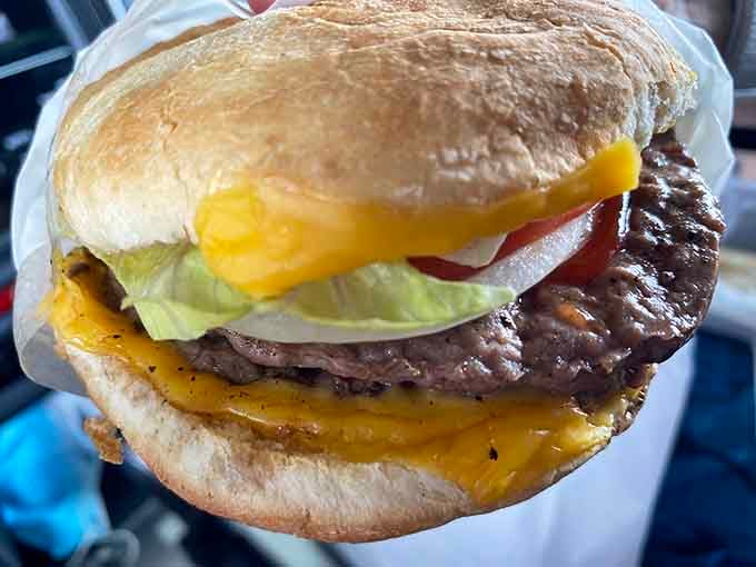 Behold the double burger, stacked high with cheese and fresh toppings that prove perfection doesn't need reinventing.