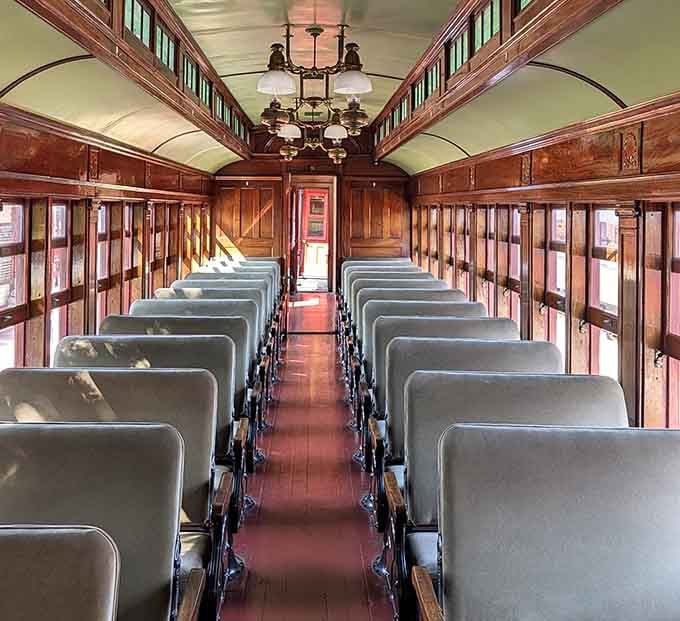 Wood paneling and period lighting create an atmosphere that makes modern first-class feel downright boring by comparison.