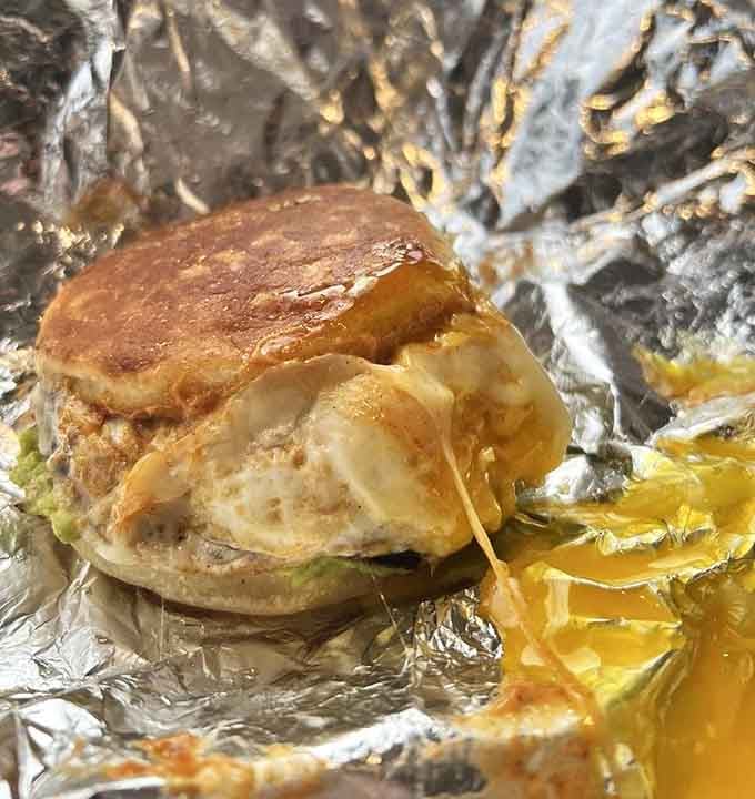 That golden yolk peeking out is basically winking at you, promising a breakfast sandwich that'll ruin all other breakfast sandwiches.