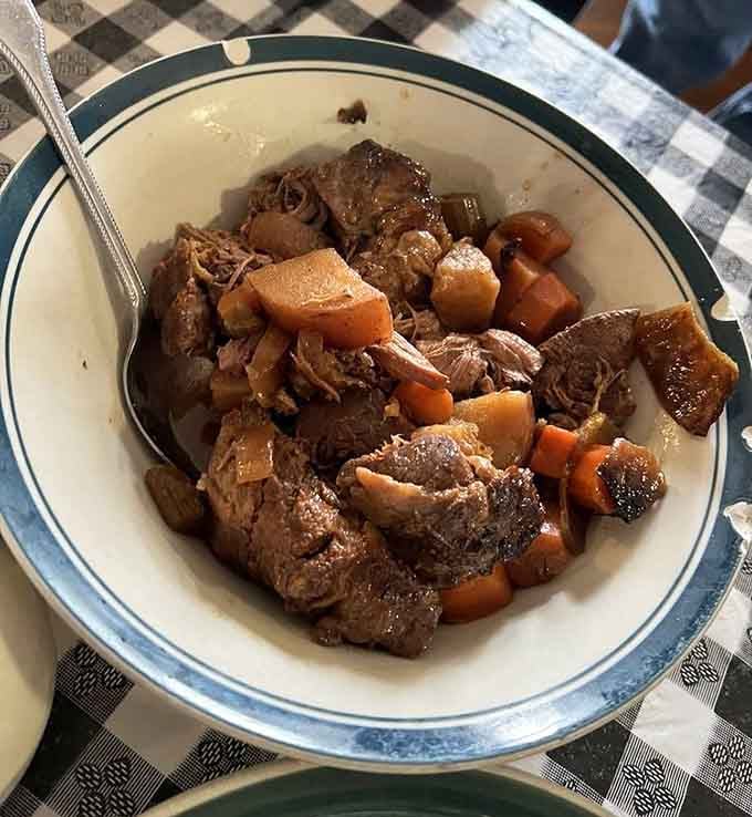 Pot roast so tender it practically falls apart just looking at it, swimming in gravy that deserves its own fan club.