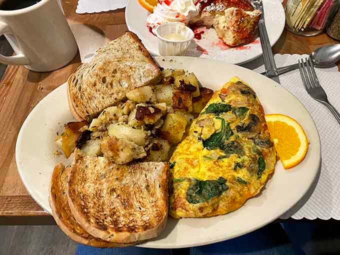 That omelet looks like it's been working out, and those potatoes have achieved peak crispiness without even trying.