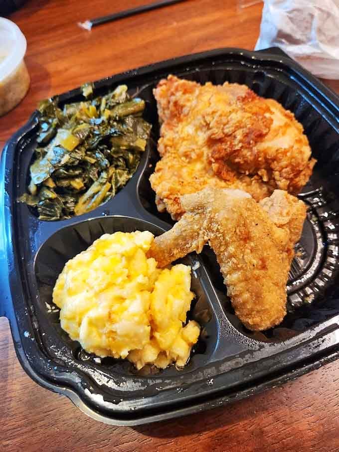 Golden fried chicken with collard greens and mac and cheese: the holy trinity of soul food done absolutely right.