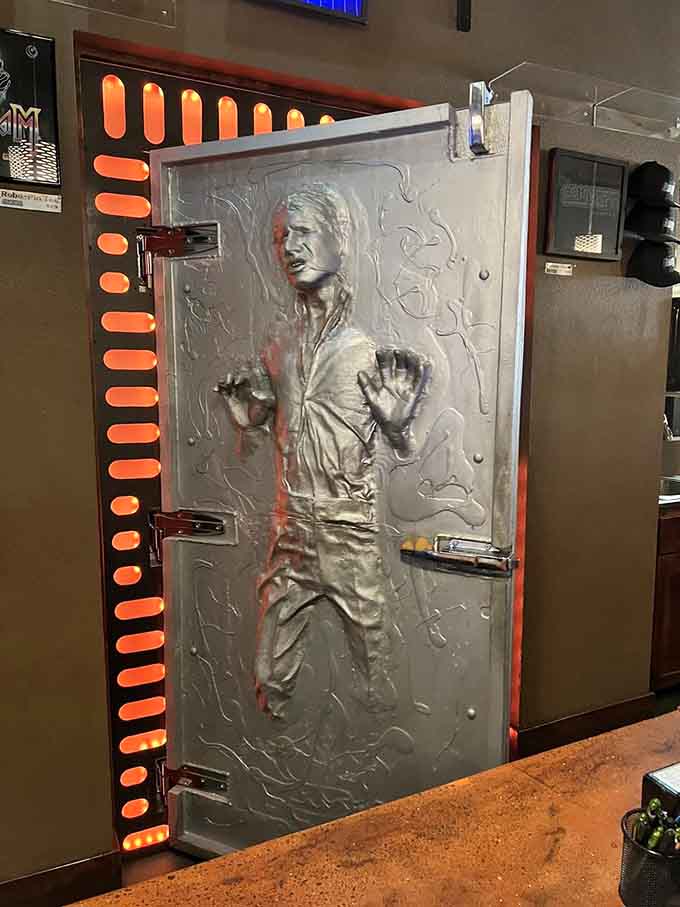 Han Solo frozen in carbonite guards the restroom, because even bathroom doors deserve to be legendary around here.
