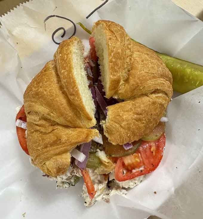 A croissant sandwich stuffed with chicken salad proves that sometimes French meets Southern and everybody wins spectacularly here.