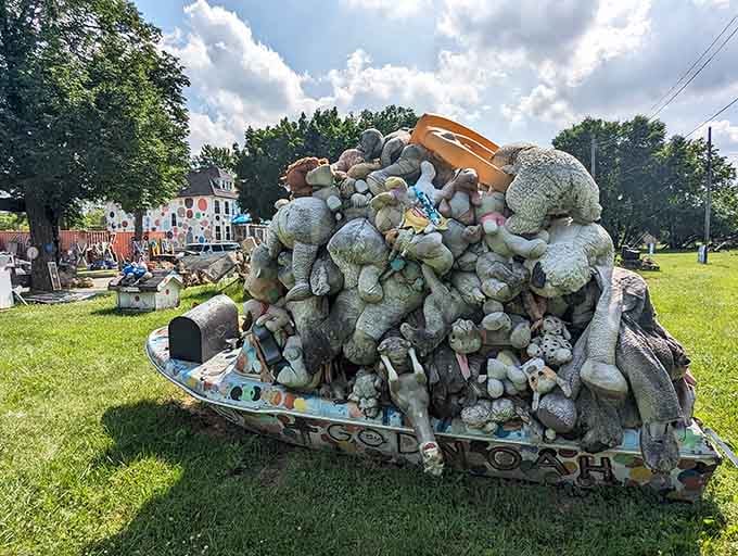 Hundreds of stuffed animals pile onto a vintage wagon, turning childhood nostalgia into a mountain of whimsical commentary.
