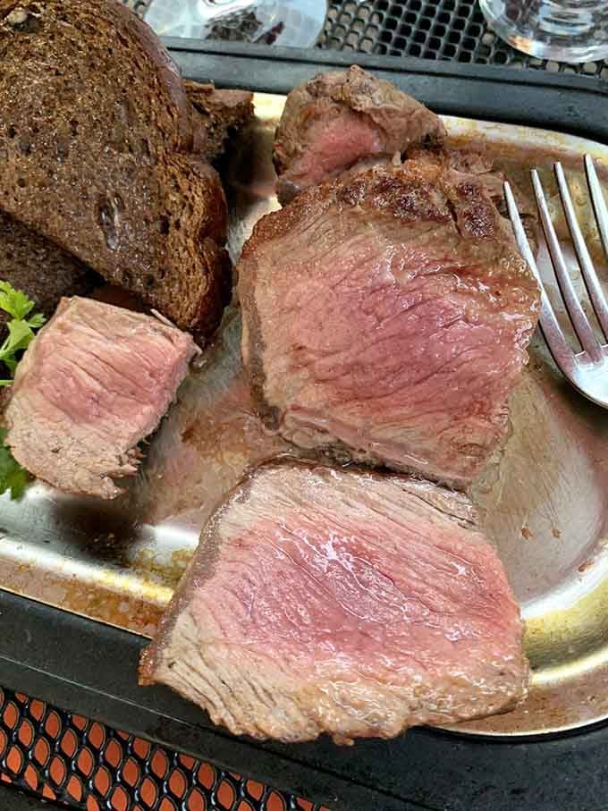 Look at that perfect medium-rare gradient, the kind of steak that makes vegetarians question their life choices momentarily.