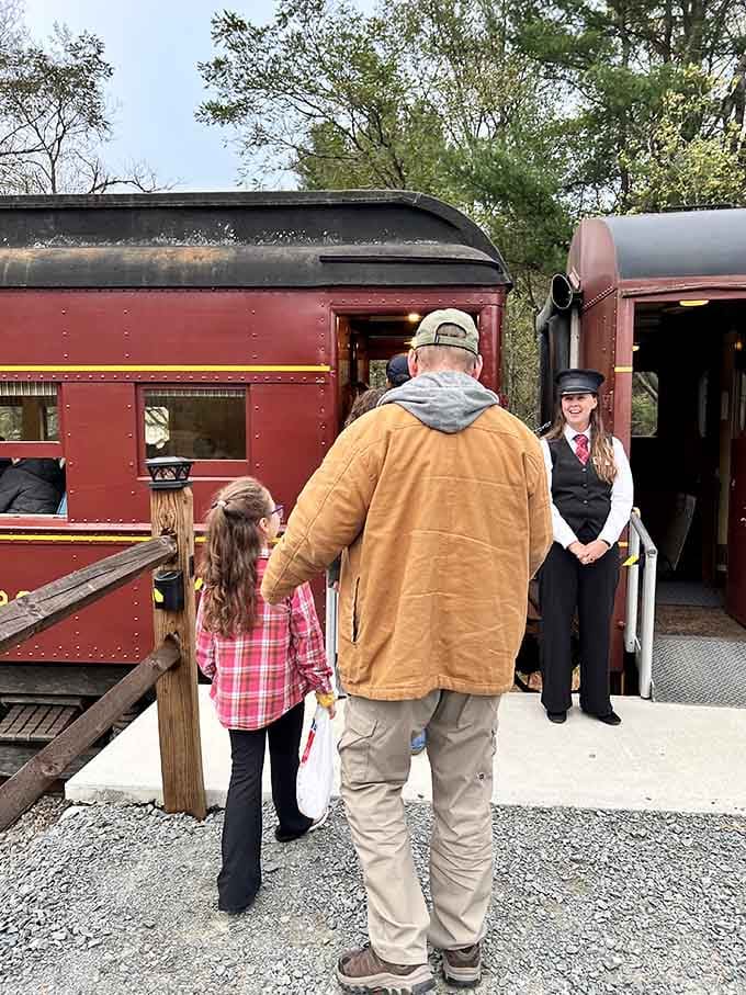 That conductor's smile says it all: you're about to experience something special, and she knows exactly what's coming around the bend.