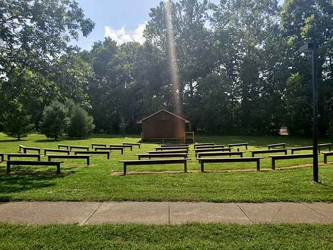 The outdoor amphitheater sits ready for summer programs, where nature provides better acoustics than any concert hall.
