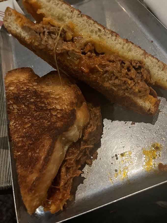 Golden, buttery bread hugging tender brisket and melted cheese is comfort food elevated to an art form.