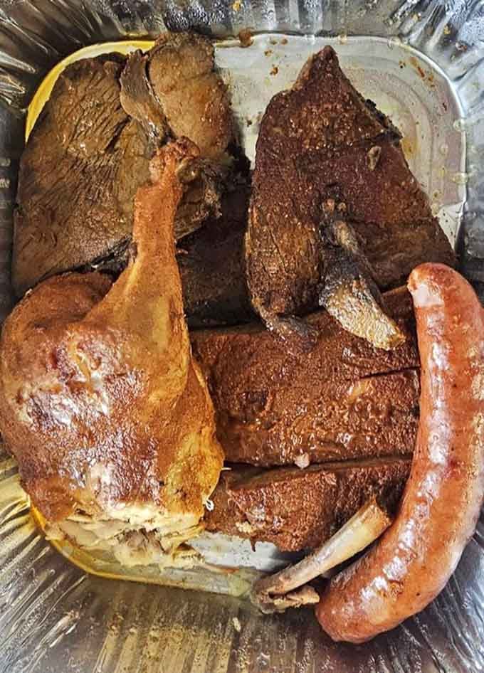 Brisket, ribs, sausage, and chicken all on one glorious platter, like the Mount Rushmore of Texas barbecue.