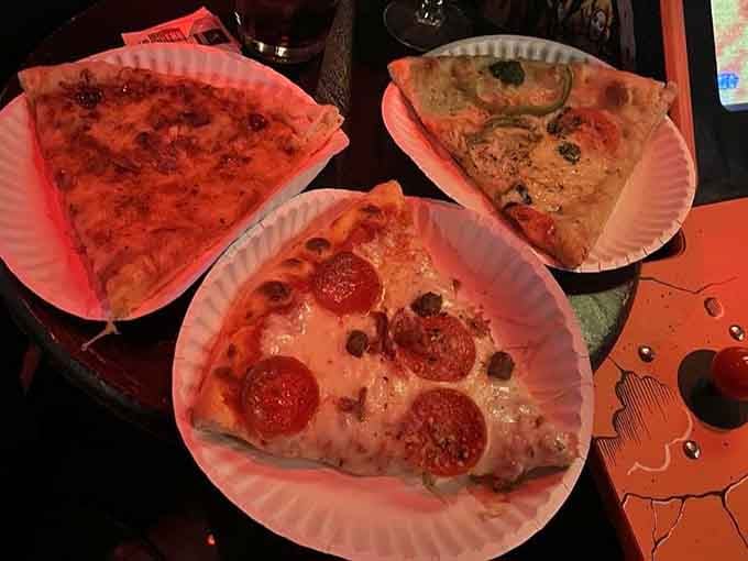 Three slices of pure decision-making anxiety: BBQ chicken, veggie-loaded Mona Lisa, or the carnivore's dream Meat pizza.